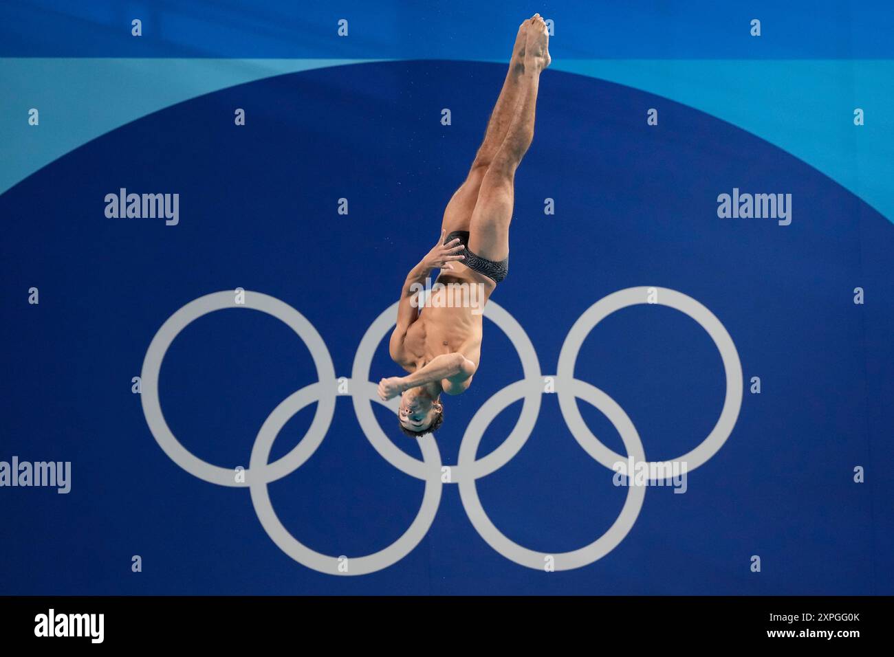 =23= competes in the men's 3m springboard diving preliminary at the ...