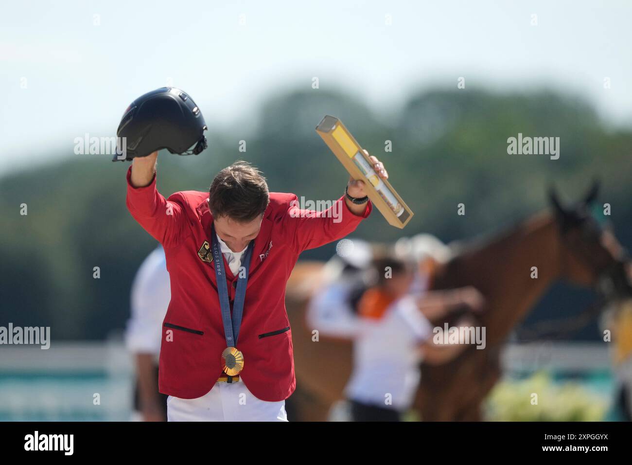 Germany's Christian Kukuk celebrates with his gold medal after winning ...