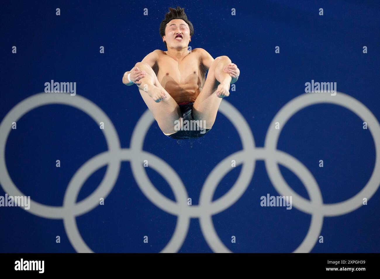 South Korea's Woo Ha-ram competes in the men's 3m springboard diving ...