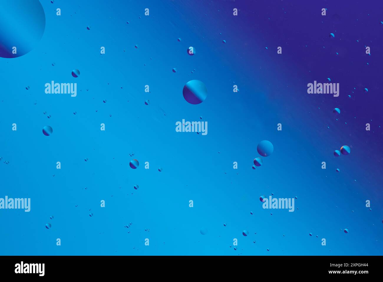 Blue tones and bubbles create an abstract, smooth pattern, reminiscent ...