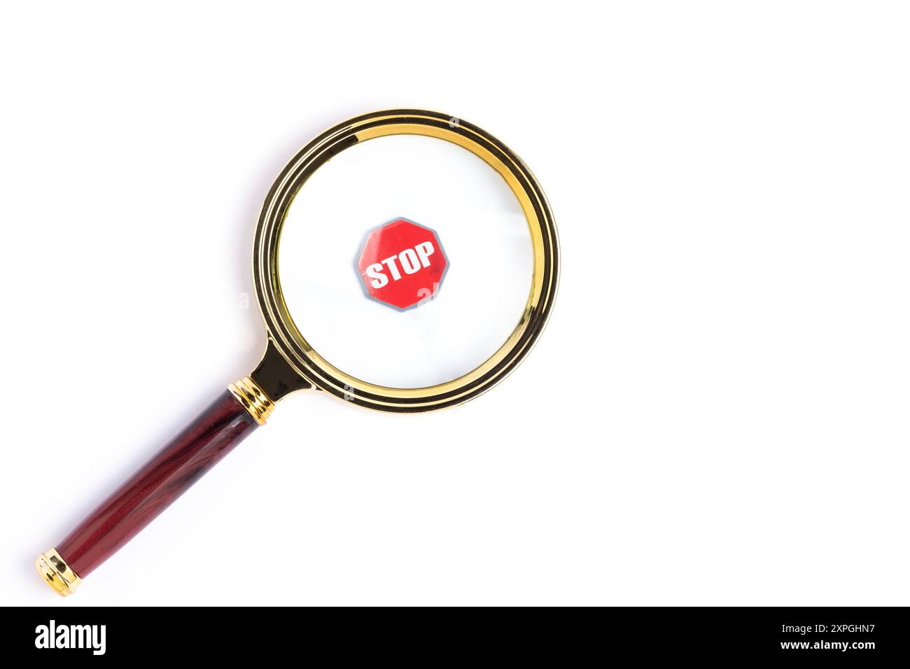 Magnifying glass with stop sign isolated on white background Stock ...