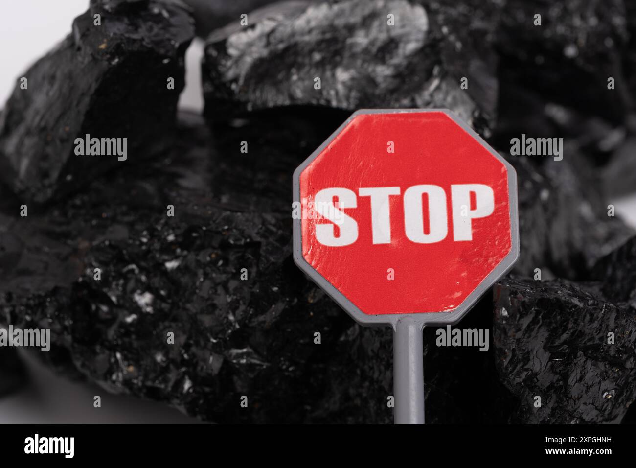Stop sign on coal background. Conceptual image of danger and caution ...