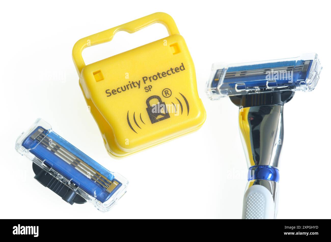 Anti-theft security tag next to razor blades. Shaving razors ...