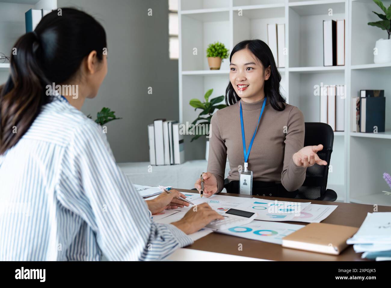 Professional Business Meeting in Modern Office with Two Women ...