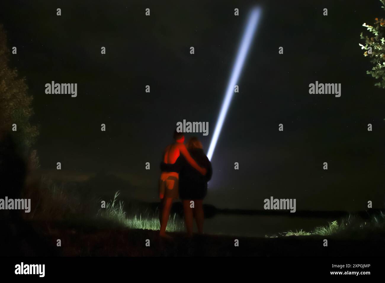 Romantic couple under a starry sky, embracing under the night sky, love ...