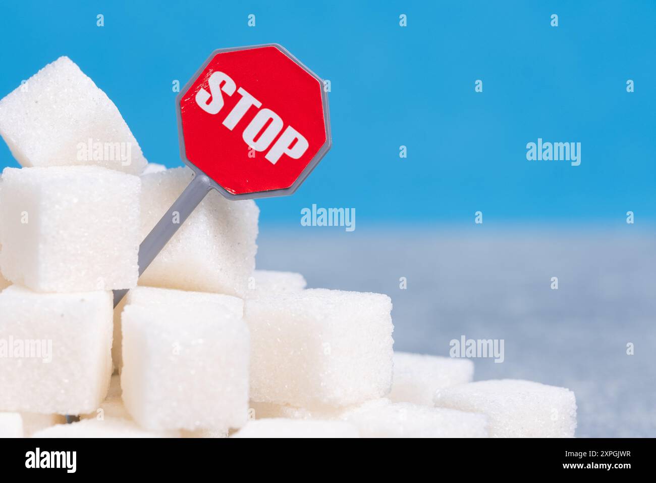 Sugar cubes and stop sign, conceptual image of sugar addiction Stock ...