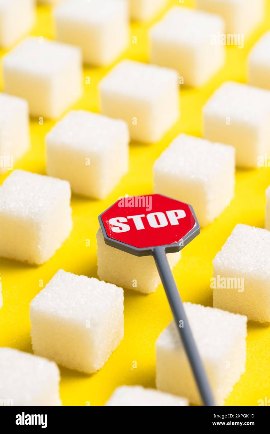 Sugar cubes and stop sign on yellow background, conceptual image Stock ...