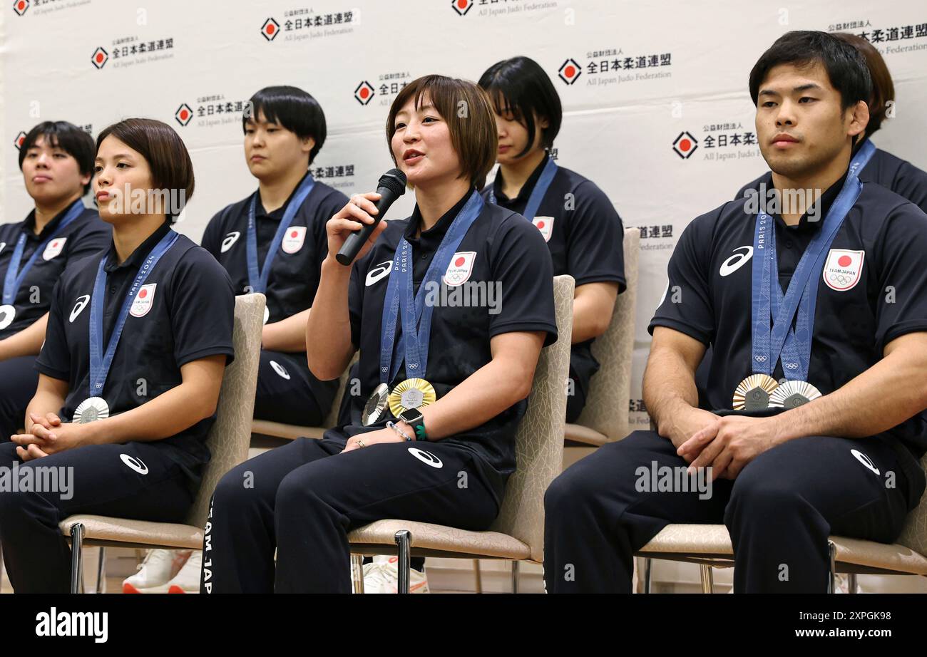 Natsumi Tsunoda of Japan (C) attenda a press conference after arriving ...