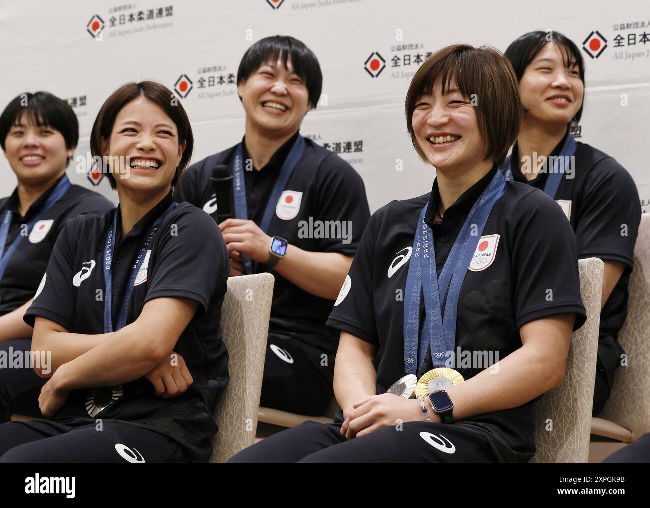Natsumi Tsunoda of Japan (R) ttends a press conference after arriving ...
