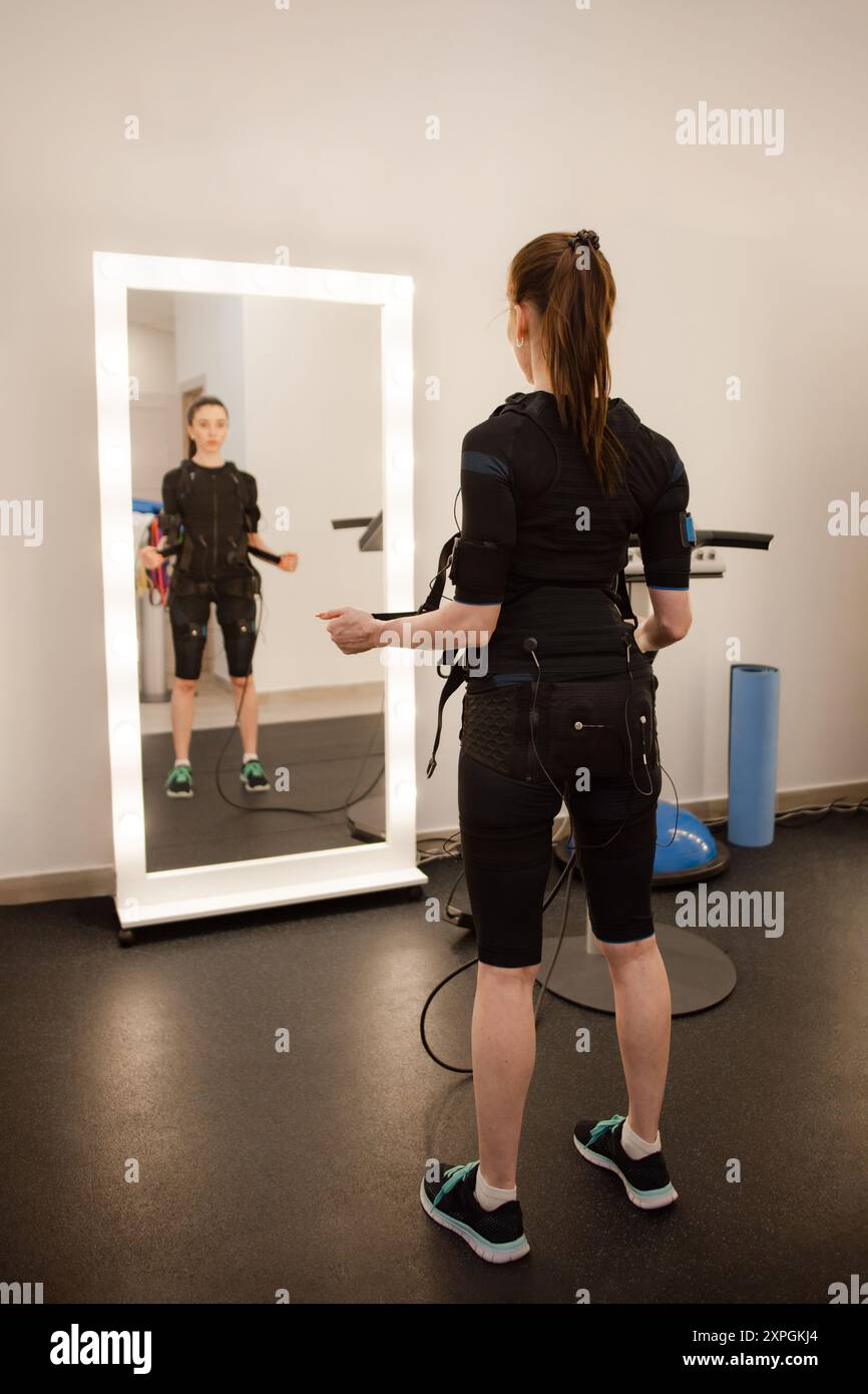EMS sport training in electrical muscle stimulation suit, using ...