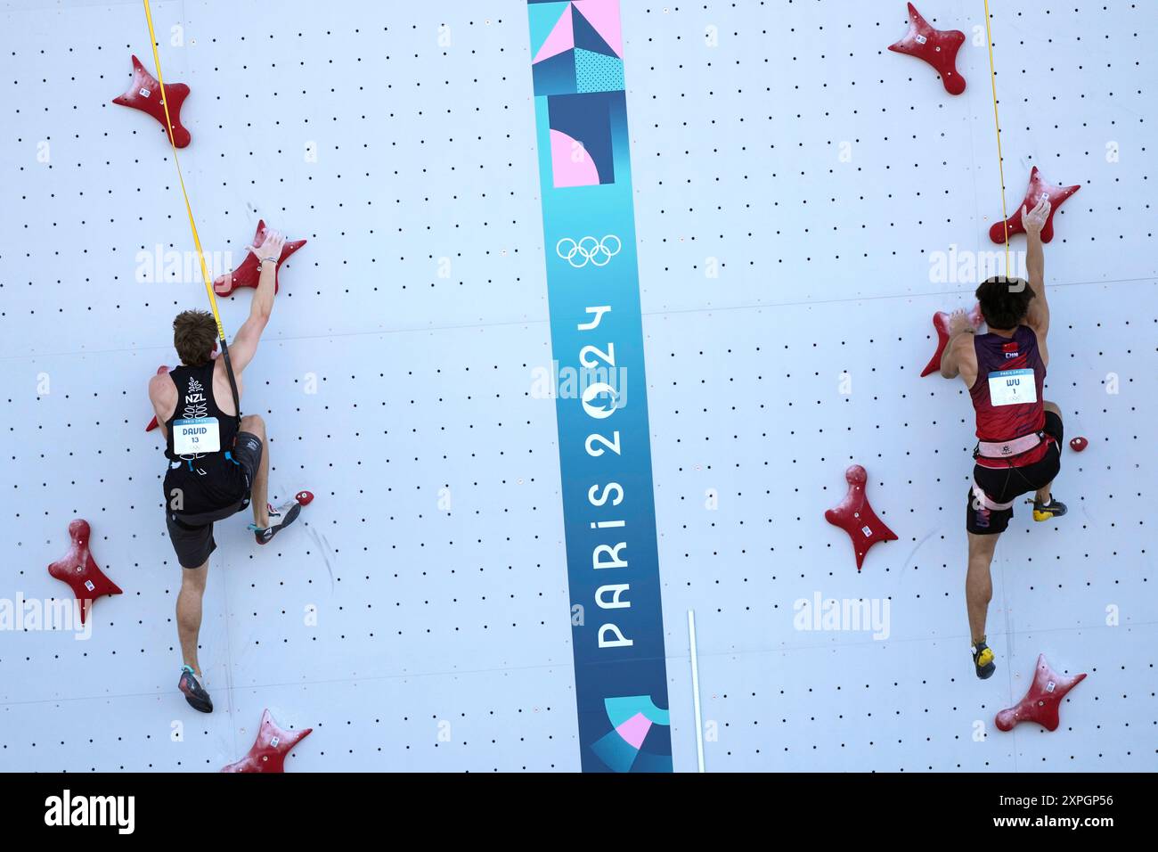 Julian David of New Zealand, left, and Wu Peng of China compete in the ...