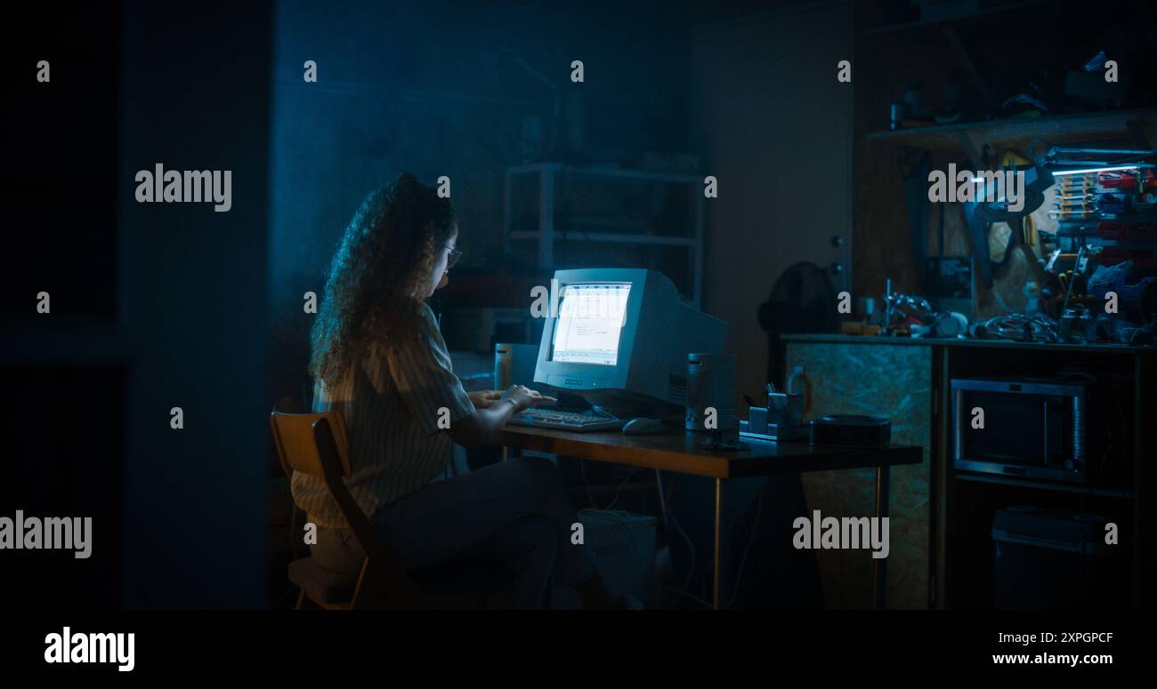 Hispanic Female Programmer Using Old Desktop Computer In Retro Garage ...