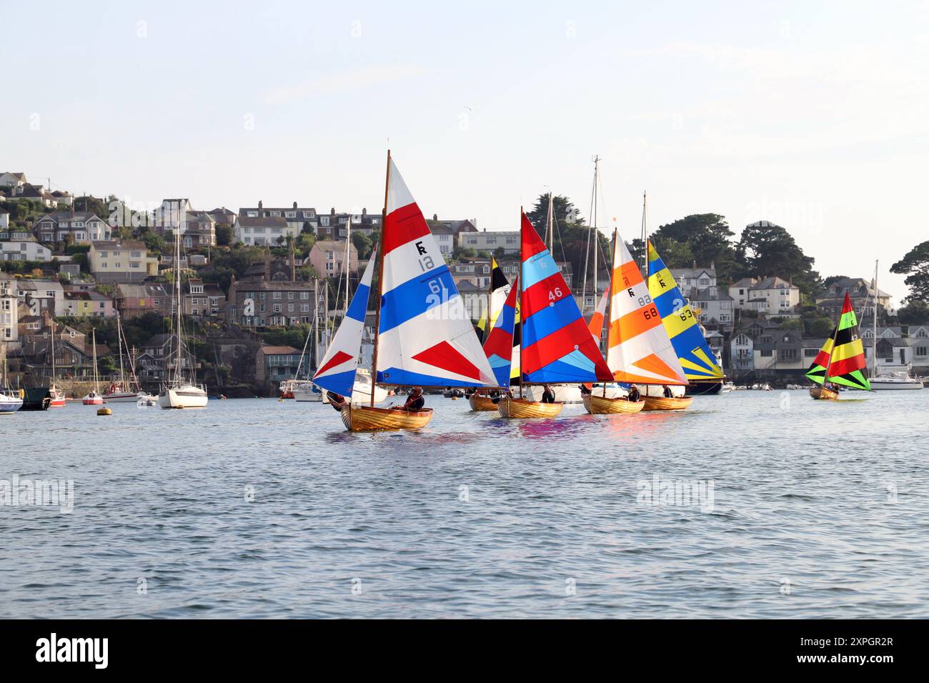 Fowey River Class Dinghies racing in Fowey Harbour Stock Photo - Alamy