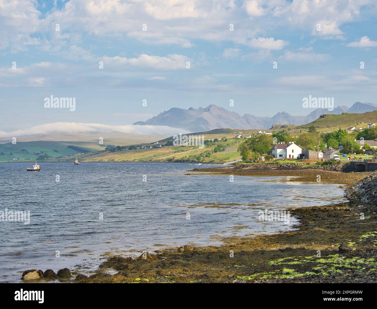 The beautiful village of Carbost on the shores of Loch Harport with its ...