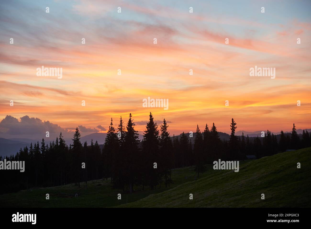 Vibrant sunset fills sky with brilliant shades of orange, pink, and ...