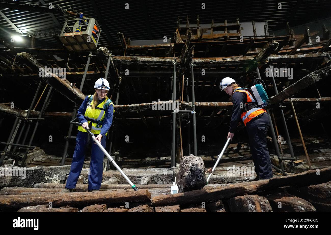 Conservation and curatorial interns undertake an inspection and clean ...