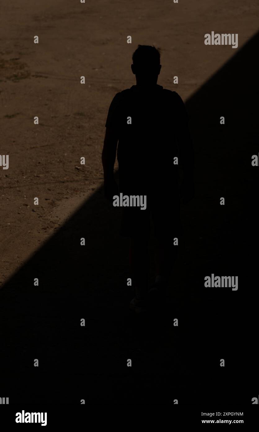 Mystery Man Walking in Sunlight Shadow Triangle: Between Two Worlds ...