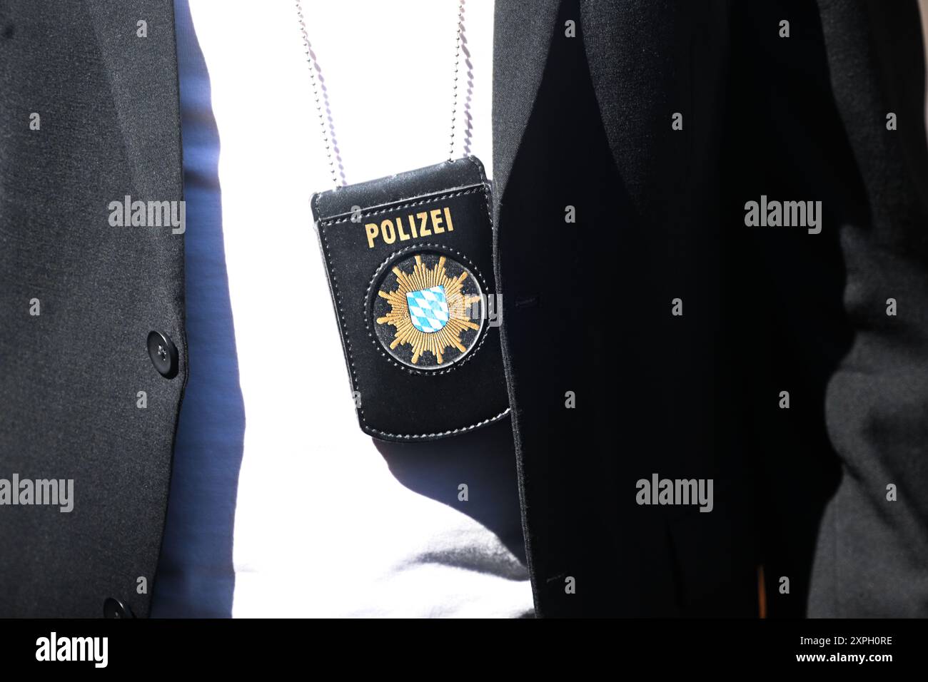 Munich, Germany. 06th Aug, 2024. A policeman wears a police badge ...