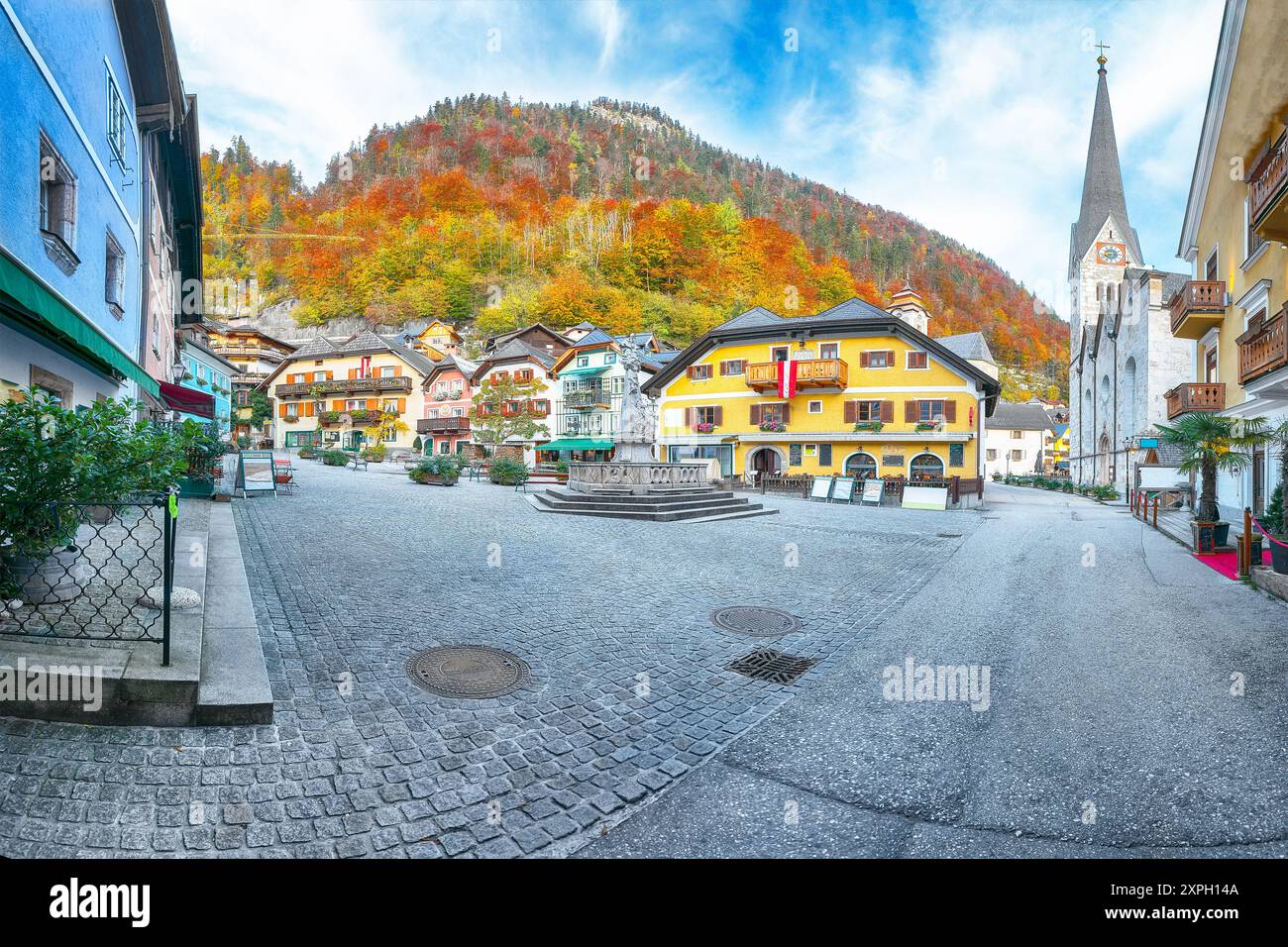 Stunning view on central square of famous Hallstatt mountain village ...