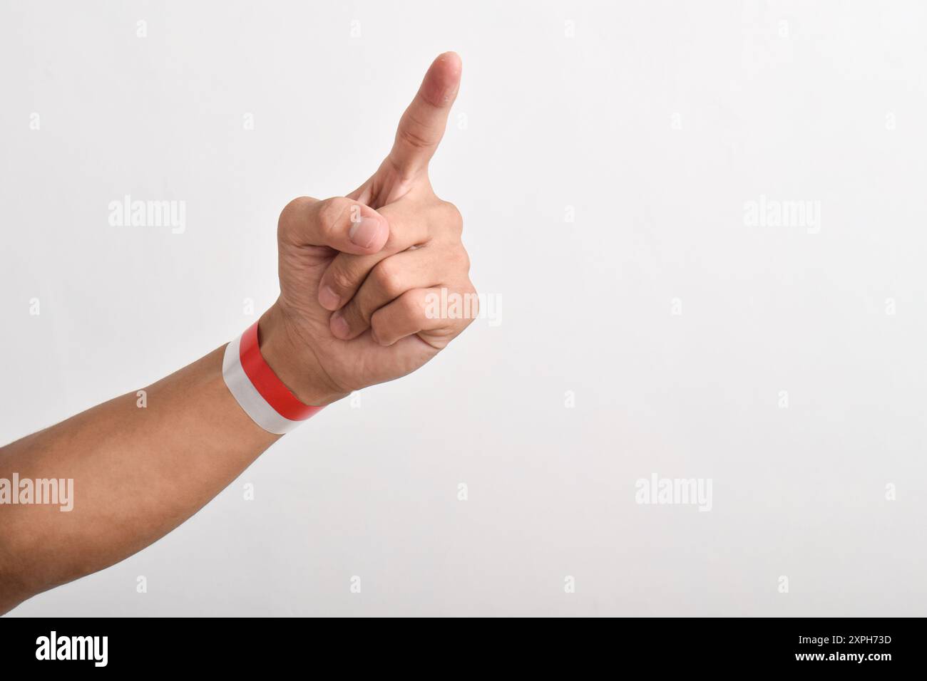 Hand pointing one finger with red and white ribbon as symbol of ...