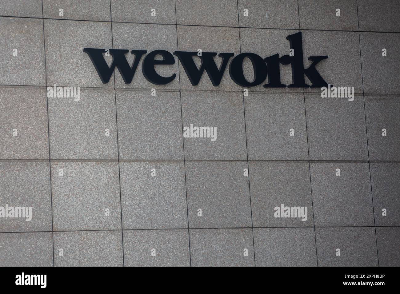 Wework logo on squarish background, Singapore Stock Photo - Alamy