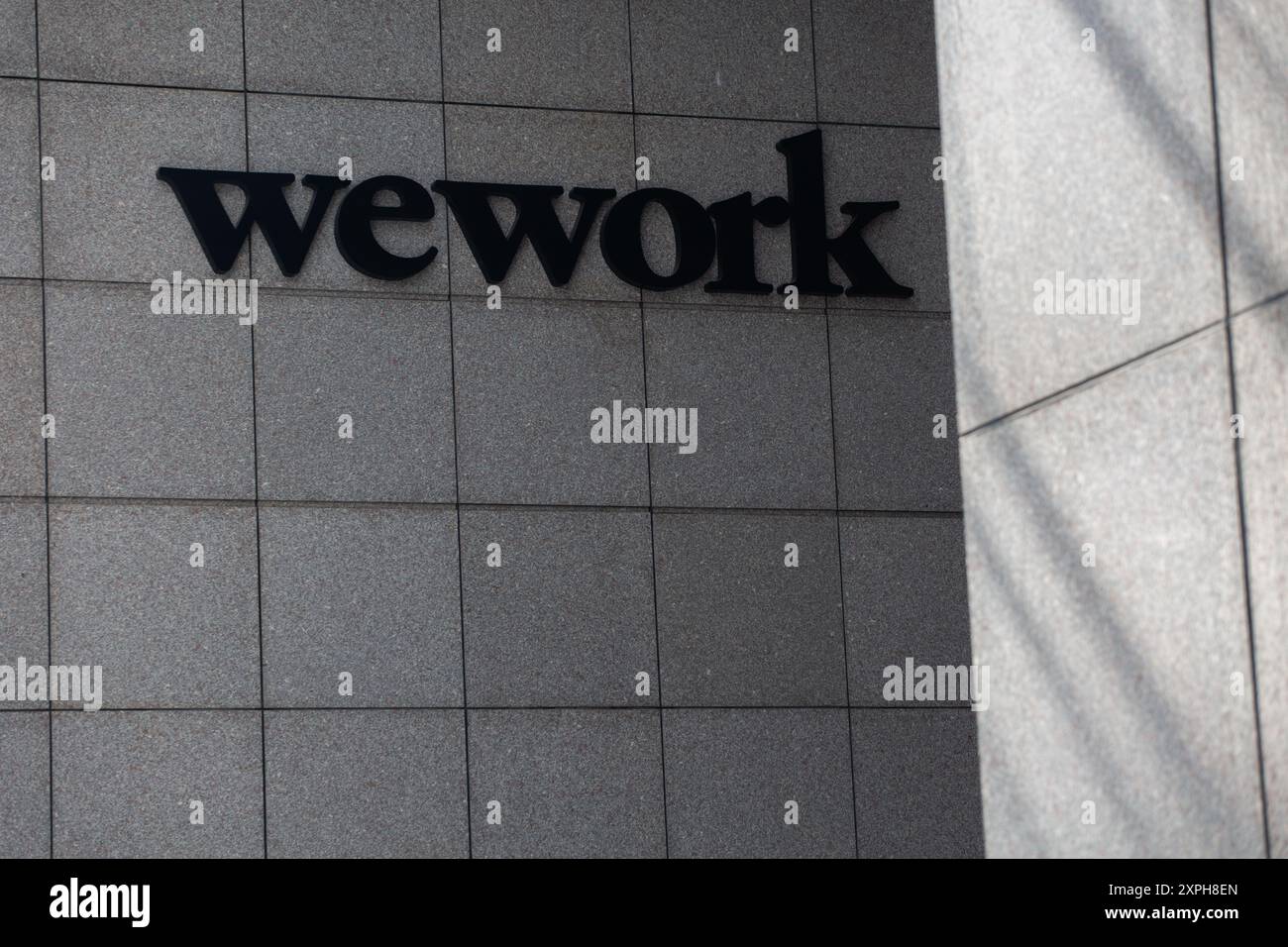 Wework logo on squarish background, Singapore Stock Photo - Alamy