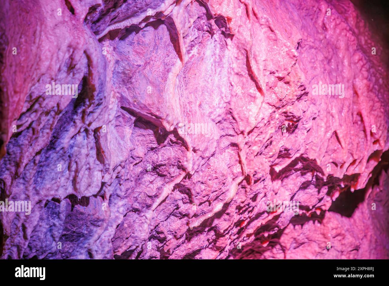 Wall of an underground rock formation illuminated with artificial ...