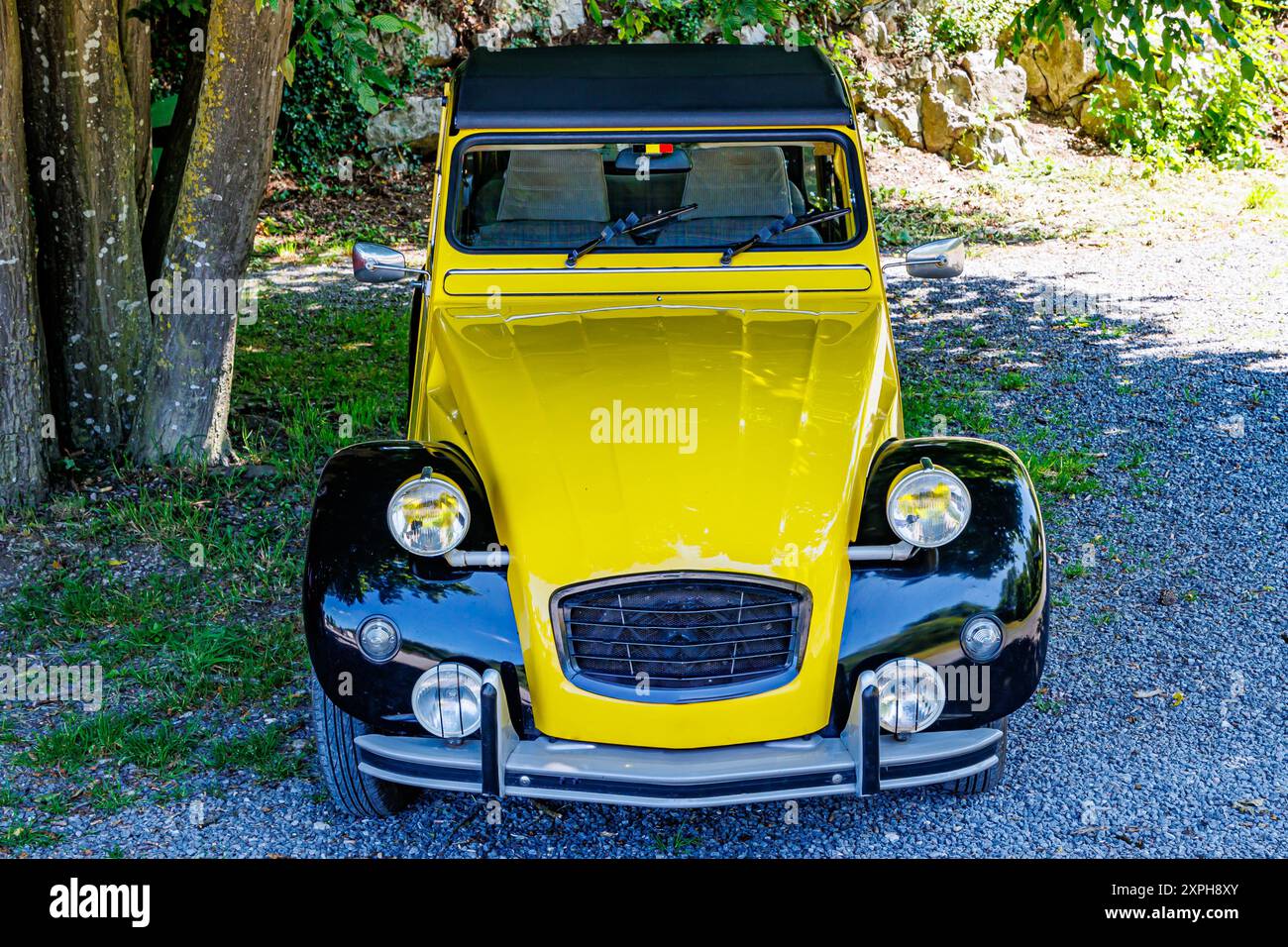 Old luxury car with yellow and black bodywork in front view ...