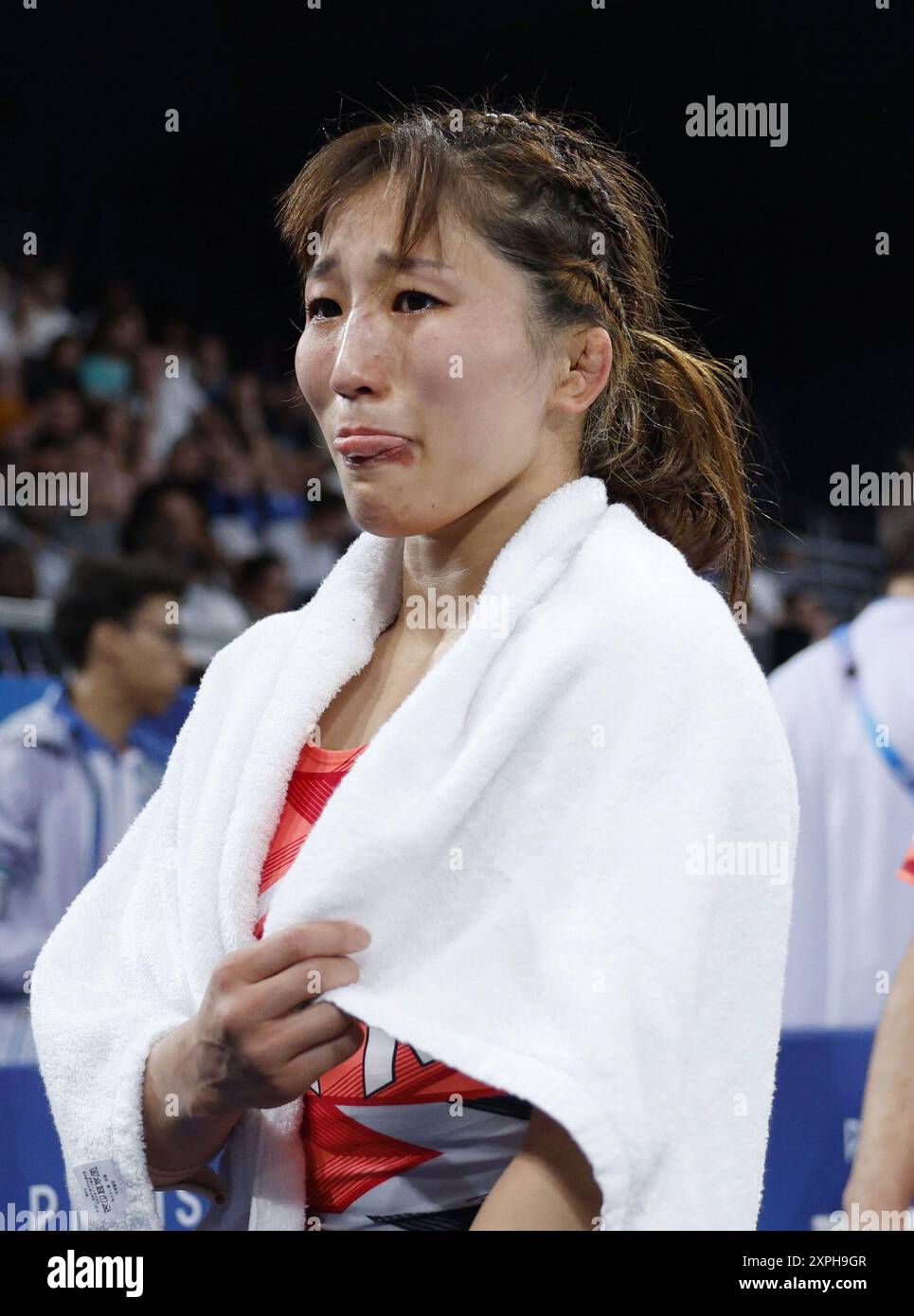 Japan's Yui Susaki reacts after losing in the first round of the women ...