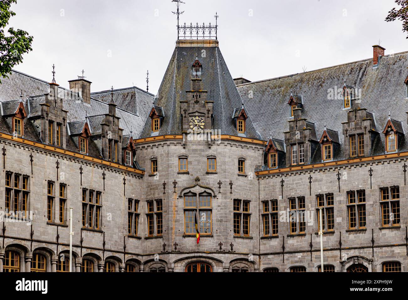 Close-up front view of Ham-sur-Heure castle, central tower between grey ...