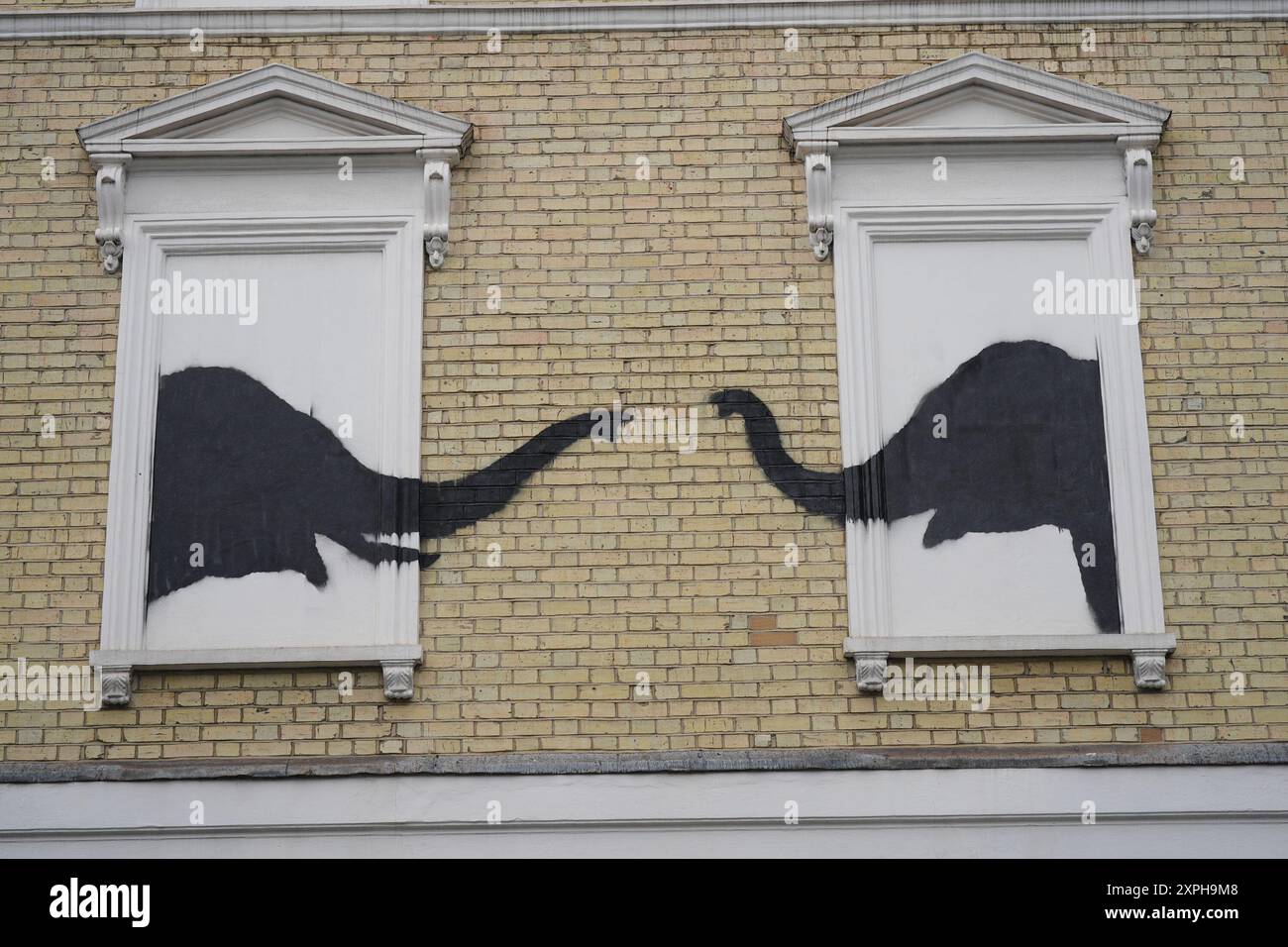 A new artwork depicting two elephants poking their heads out of blocked ...