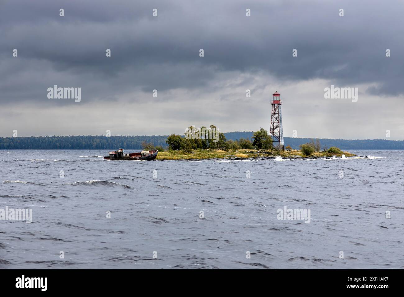 Ivanovsky Island in Lake Onega with a sunken ship and a lighthouse ...