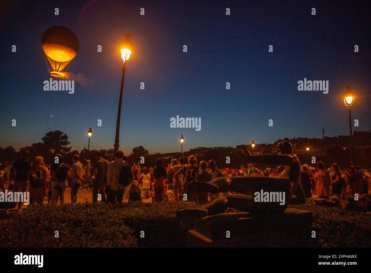 When the sun sets over Paris, many curious onlookers come to gather ...