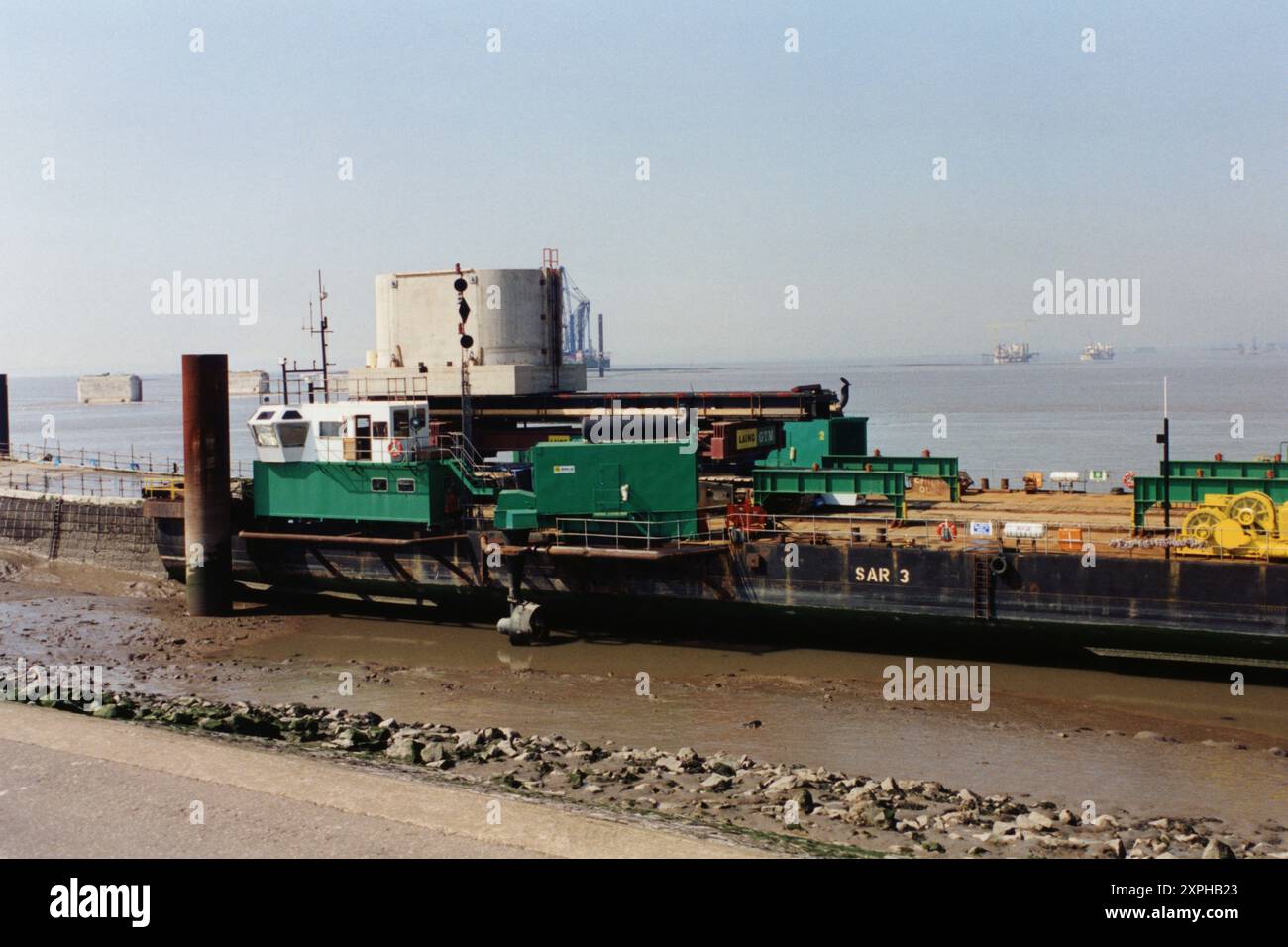 Concrete section on barge waiting to go out to caaisson to build tower ...