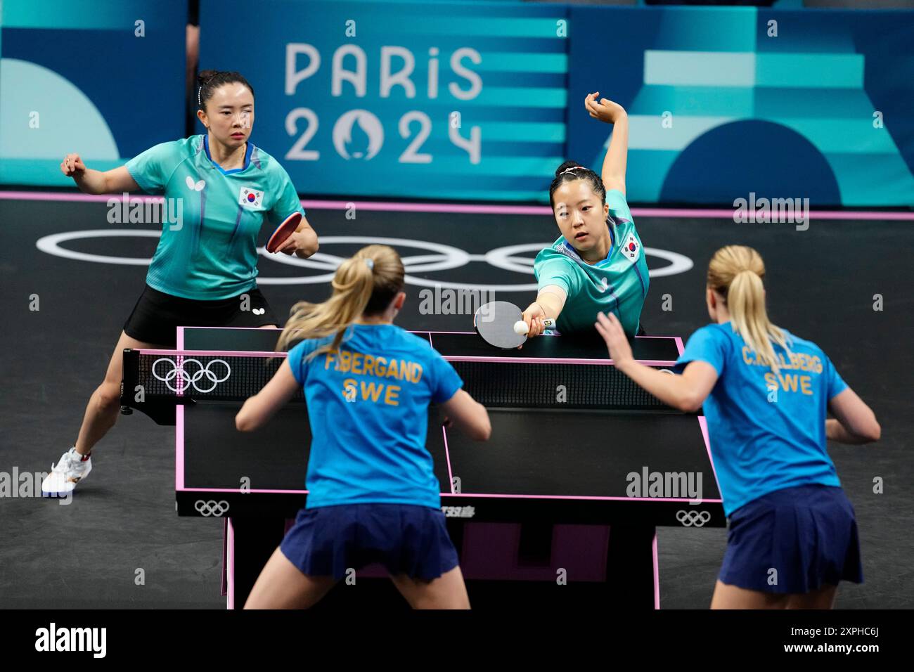 South Korea's Shin Yubin, background right, and Jeon Jihee play against ...