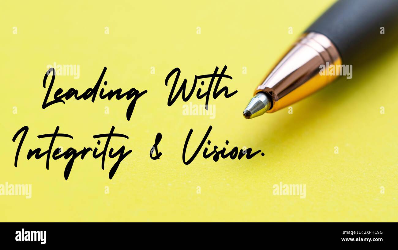 Leading with integrity and visions text with close up pen background ...