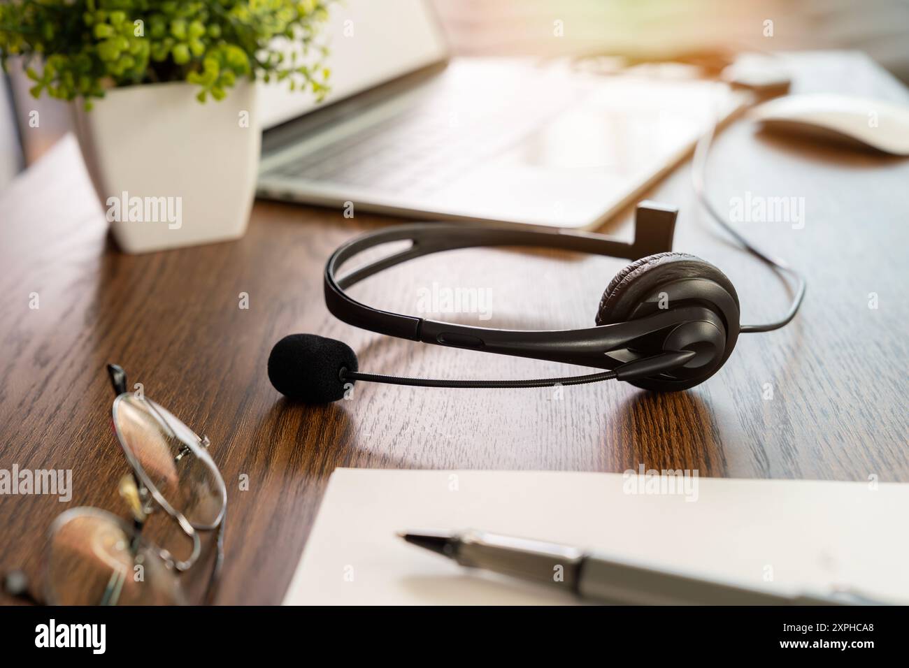 A work desk with headphones placed on it Stock Photo - Alamy