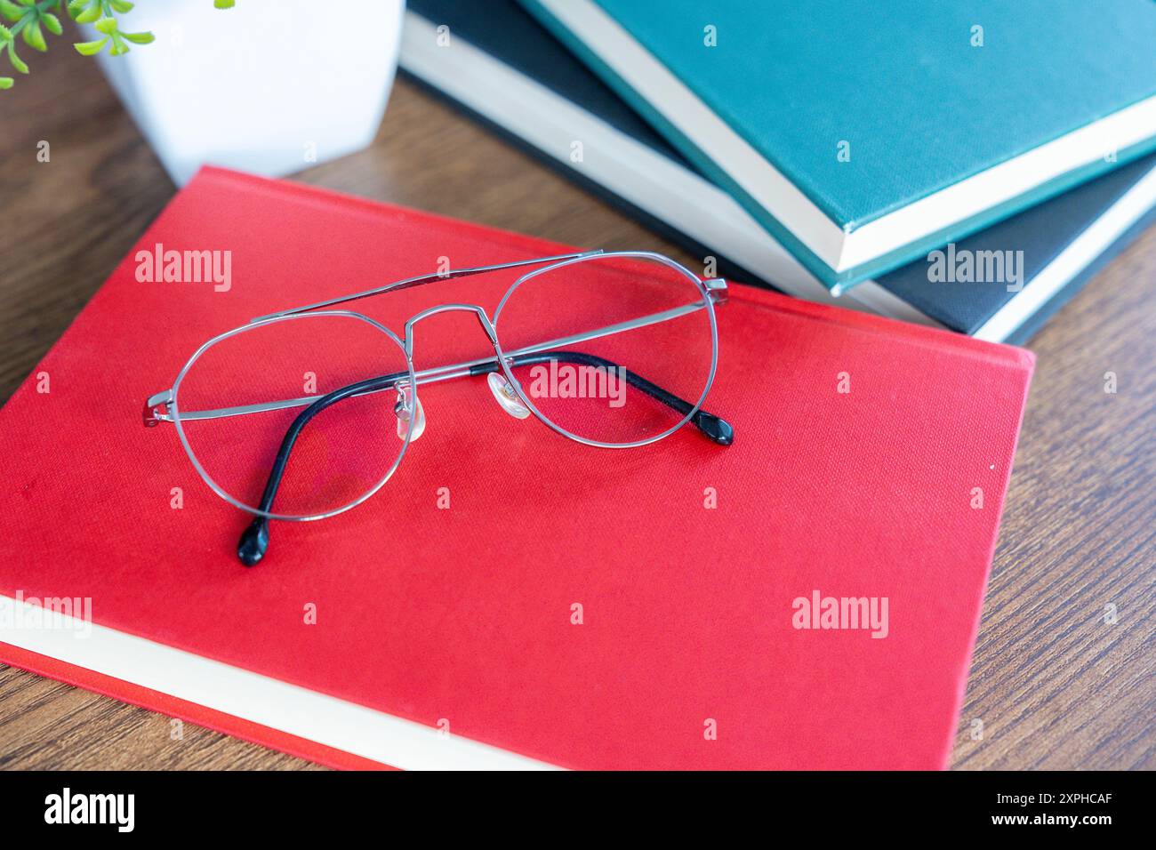 Stack books eyeglasses cup hi-res stock photography and images - Alamy