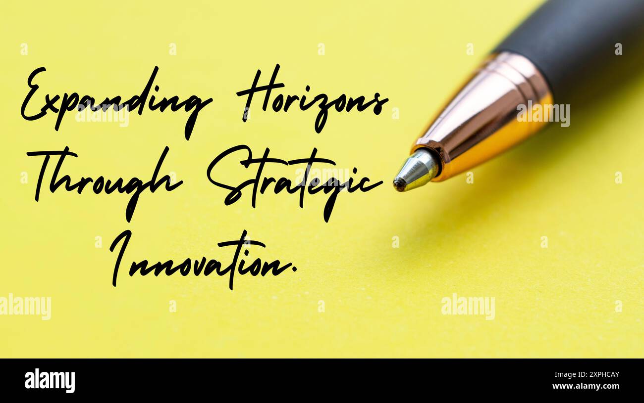 Expanding horizons through strategic innovation text with close up pen ...