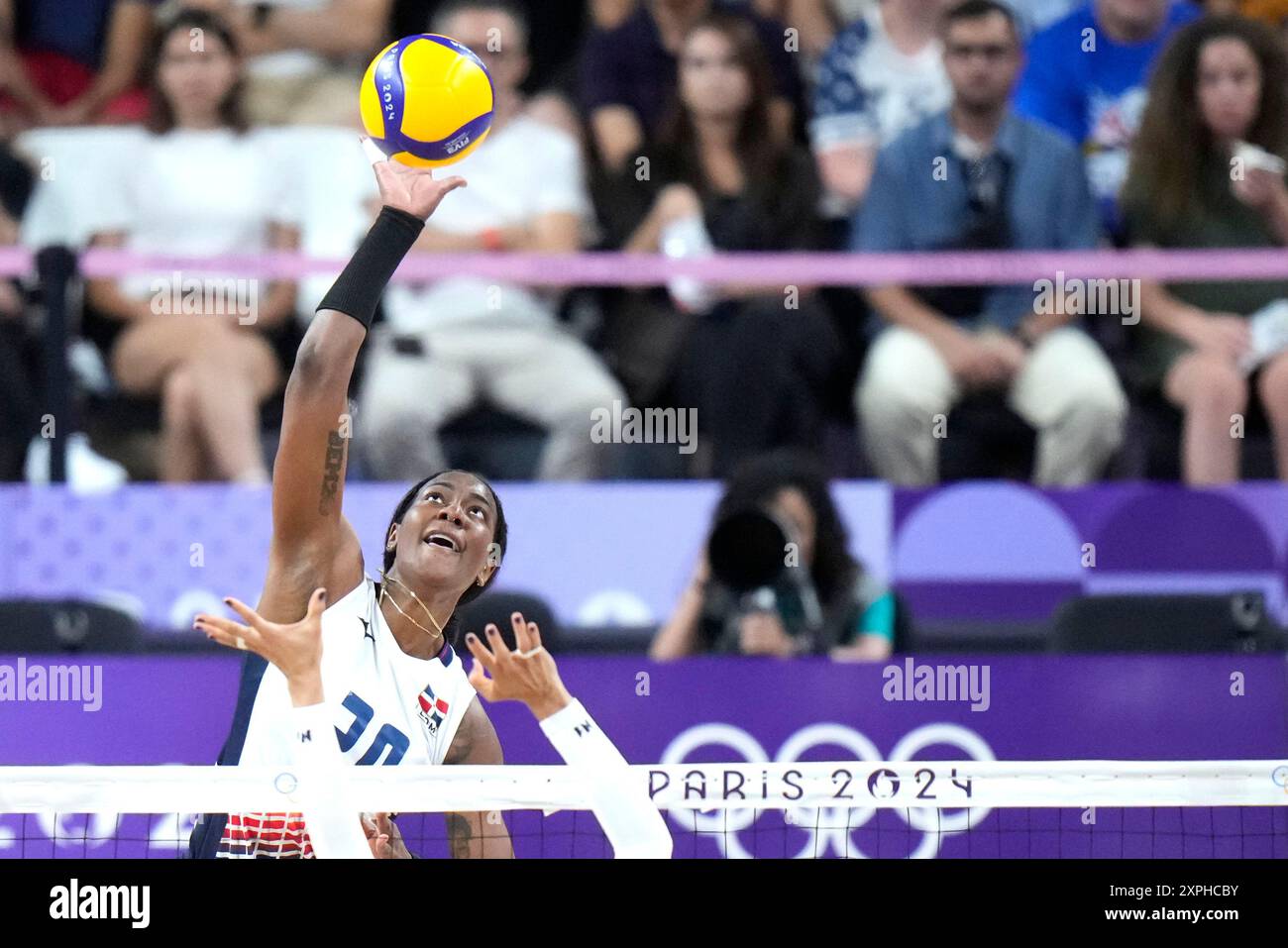Brayelin Martinez of Dominican Republic spikes a ball during a women's ...