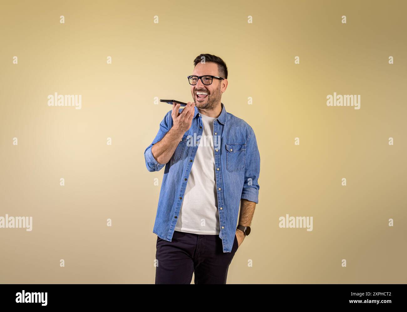 Cheerful businessman sending voicemail hi-res stock photography and ...