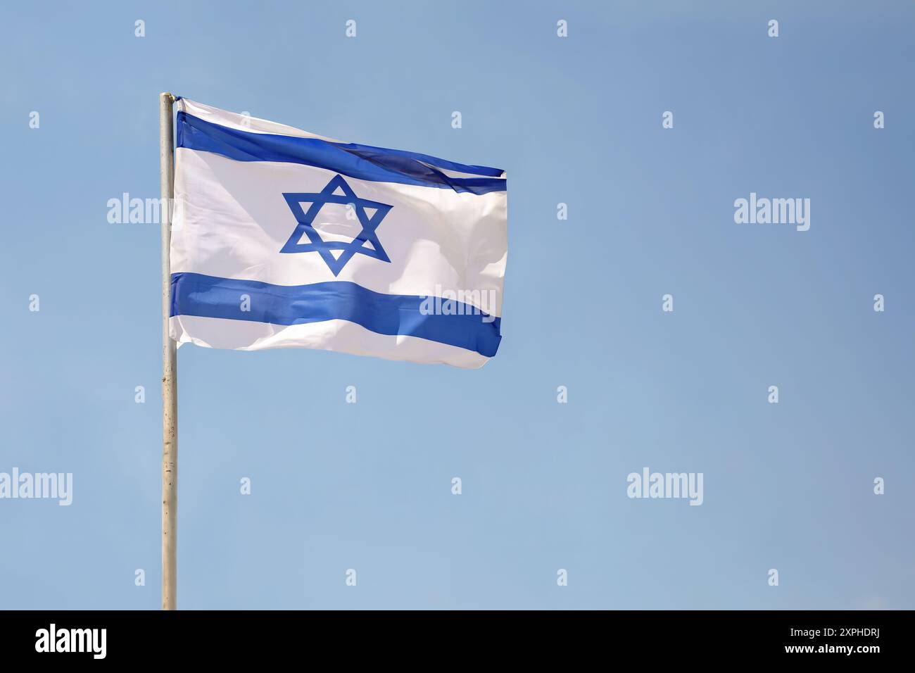The Israeli flag blowing in the wind by the U.S. Embassy in Jerusalem ...