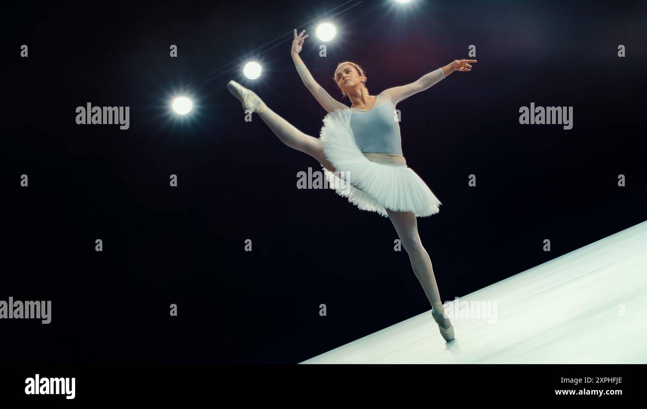 Dedicated Ballet Dancing Ballerina in White Tutu Performs High Grand ...