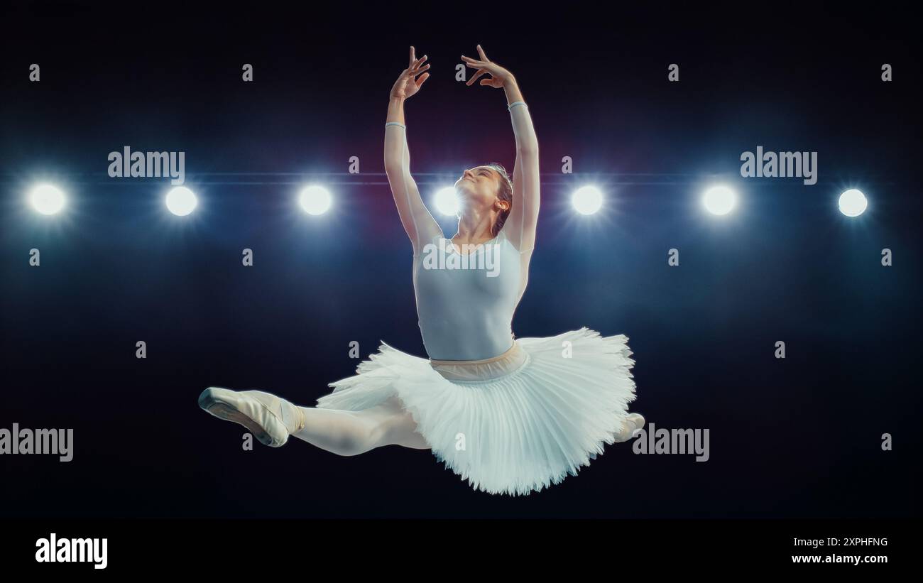 Skilled Ballet Dancing Ballerina in White Tutu Performs High Grand Jete ...