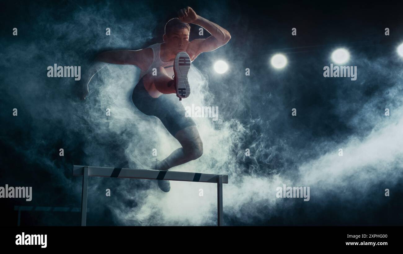 Male athlete jumping hurdle mid hi-res stock photography and images - Alamy