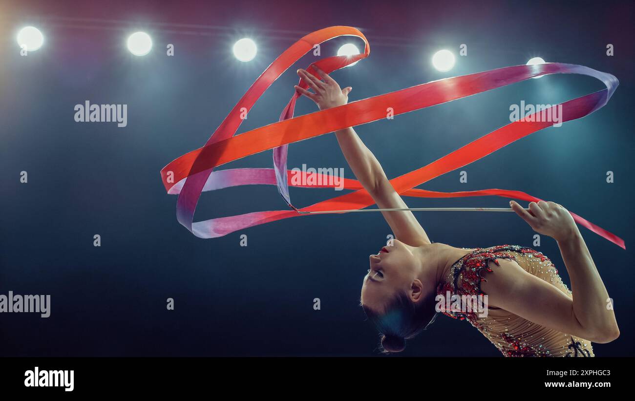 Elegant Female Gymnast in Stunning Backbend, Skillfully Twirling ...