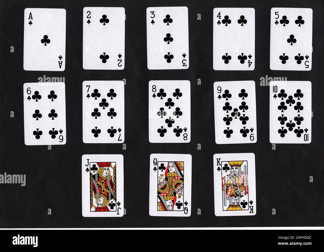 A full suit of clubs playing cards on a black background Stock Photo ...