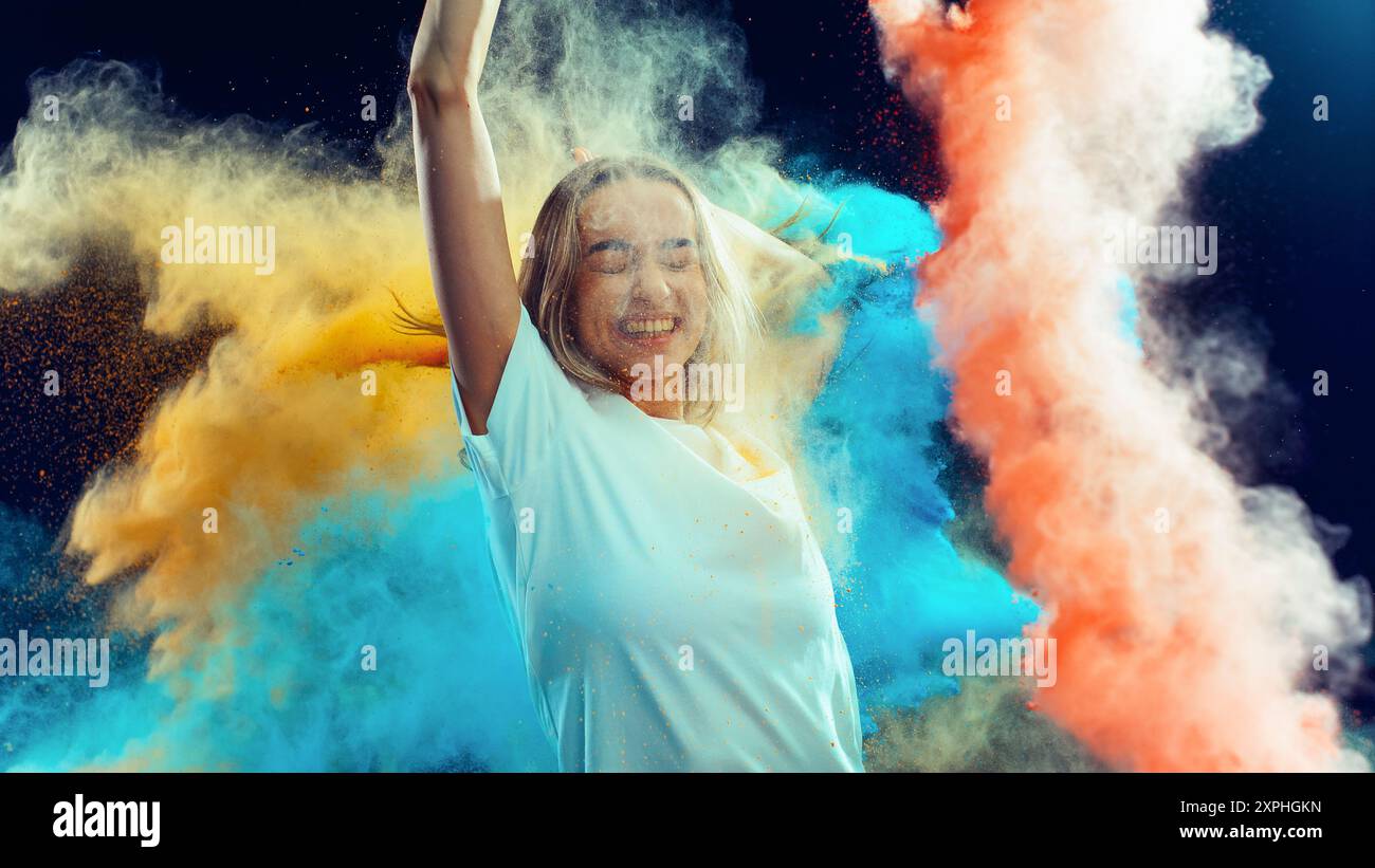 Joyful Woman Celebrates With Vibrant Colored Powder Exploding Around ...
