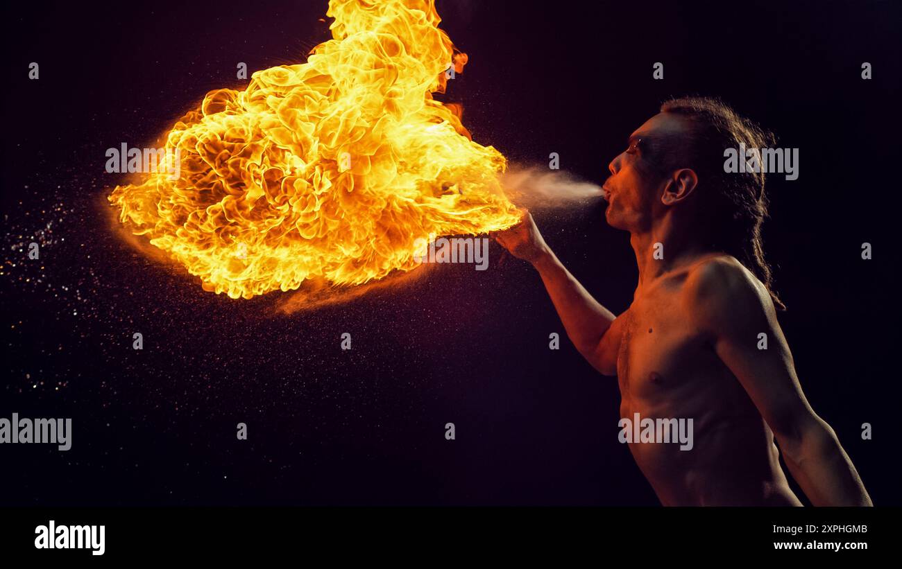 Male Fire Performer With Dreadlocks Skillfully Exhales Massive Fireball ...