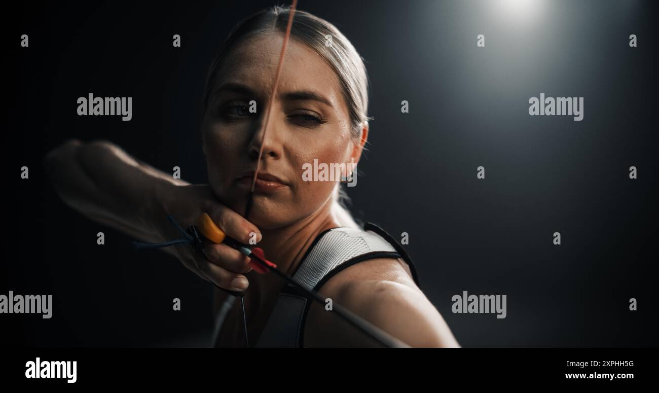 Portrait of a Beautiful Female Archer Holding a Modern Compound Bow ...